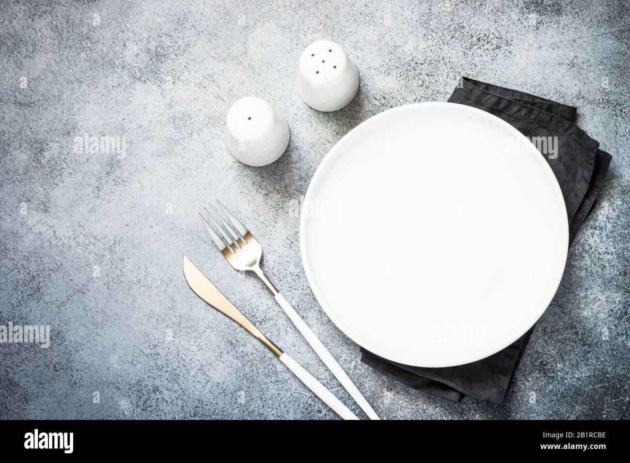 Cutlery set at stone kitchen table top view Stock Photo - Alamy