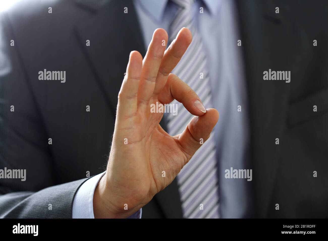 Male arm show OK or confirm during conference Stock Photo - Alamy