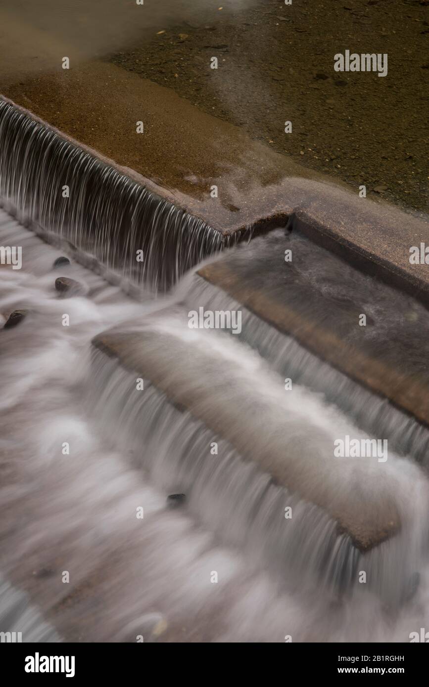 Water flowing over a stepped weir at Laxey on the Isle of Man, UK Stock ...