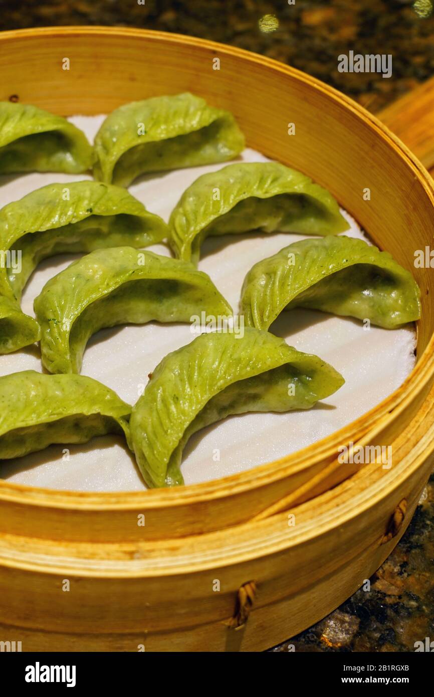 Green Dim sum dumplings in a steam basket Stock Photo - Alamy
