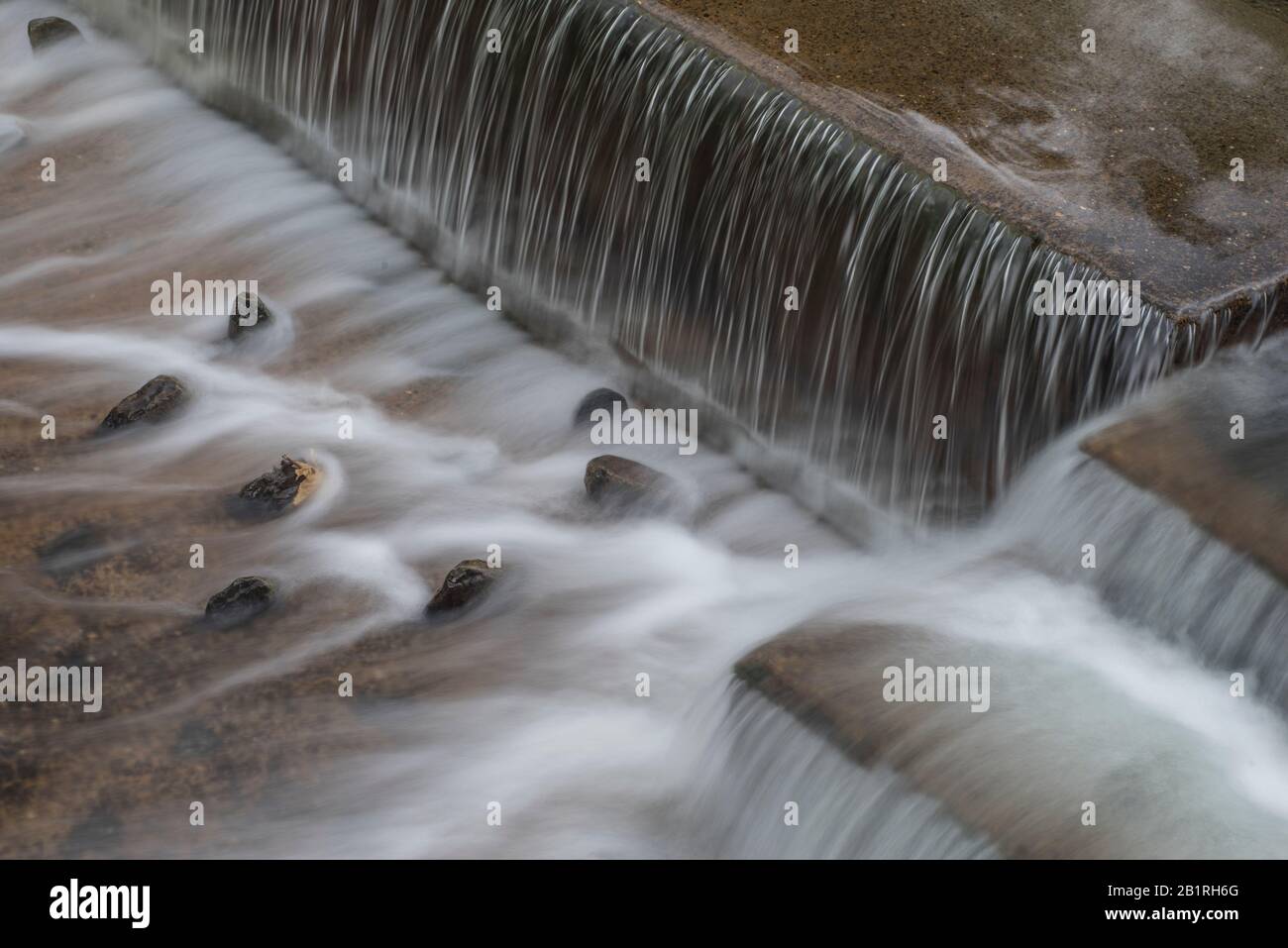 Water flowing over a stepped weir at Laxey on the Isle of Man, UK Stock ...