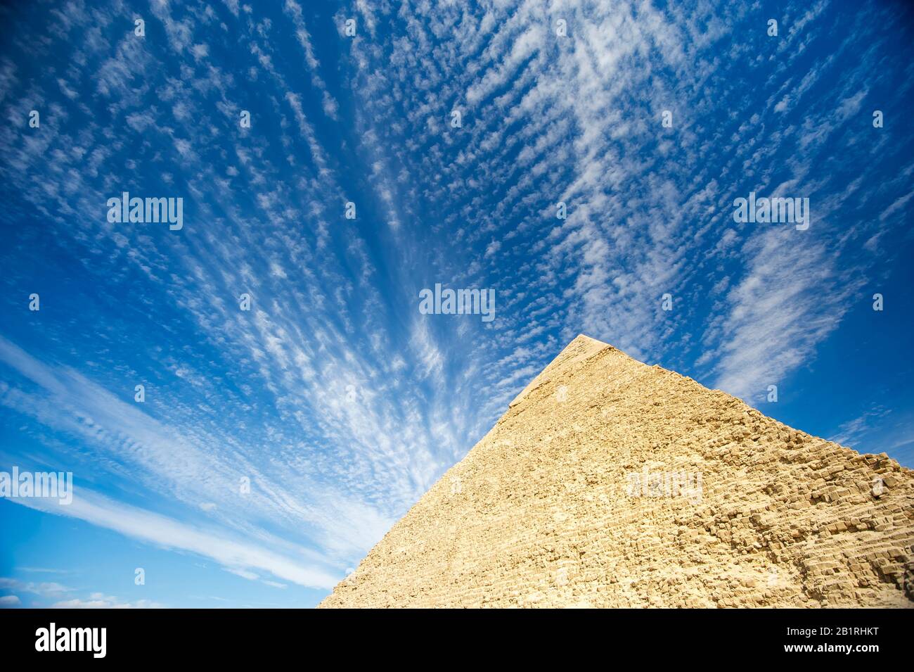 Blue sky view of the Great Pyramid with dramatic cloudscape in Giza ...