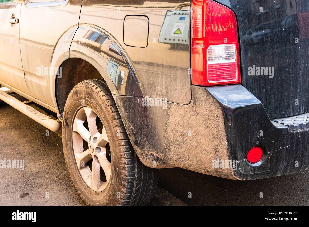 Detail view of dirty Nissan car, dirty wheels. Bucharest, Romania, 2020 ...