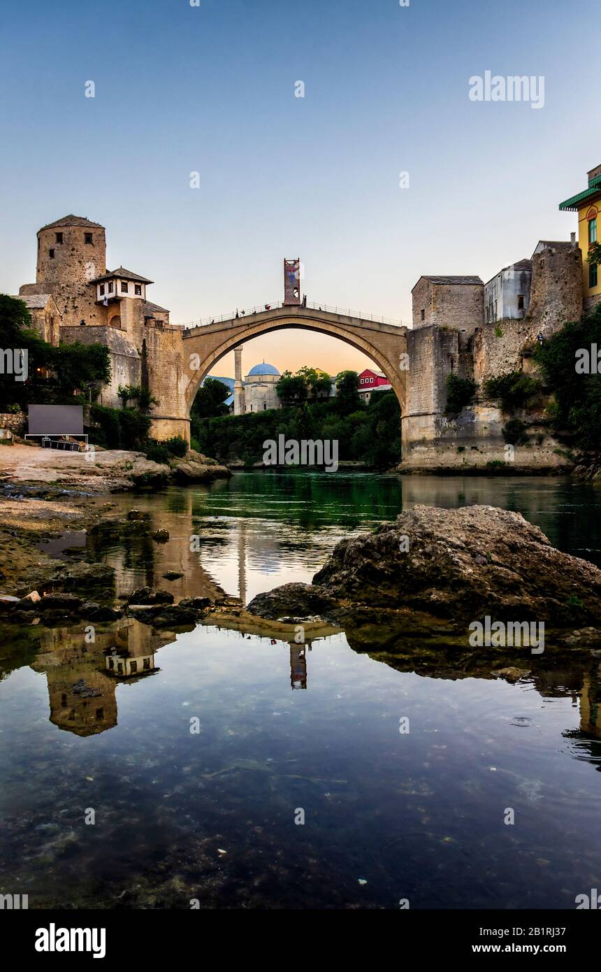 The old Bridge of Mostar (Stari Most) at dawn with its reflection in ...