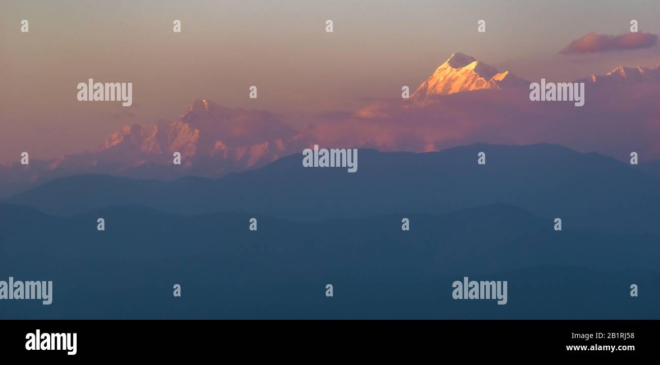 Morning light strikes the high peaks of Mount Trishul in the Indian ...