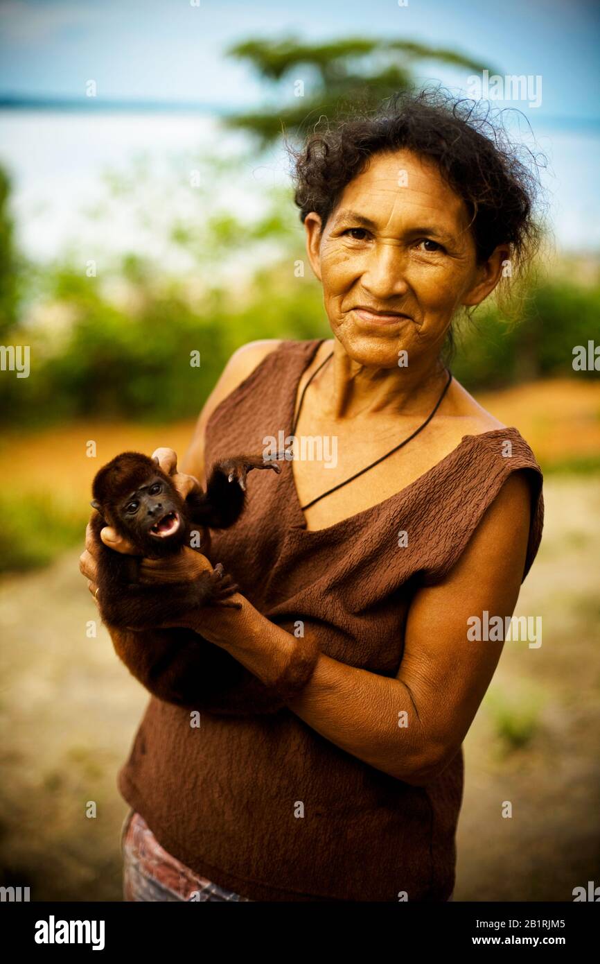 Woman Holding Monkey, Santo Elias Community, Negro River, Novo Airão ...