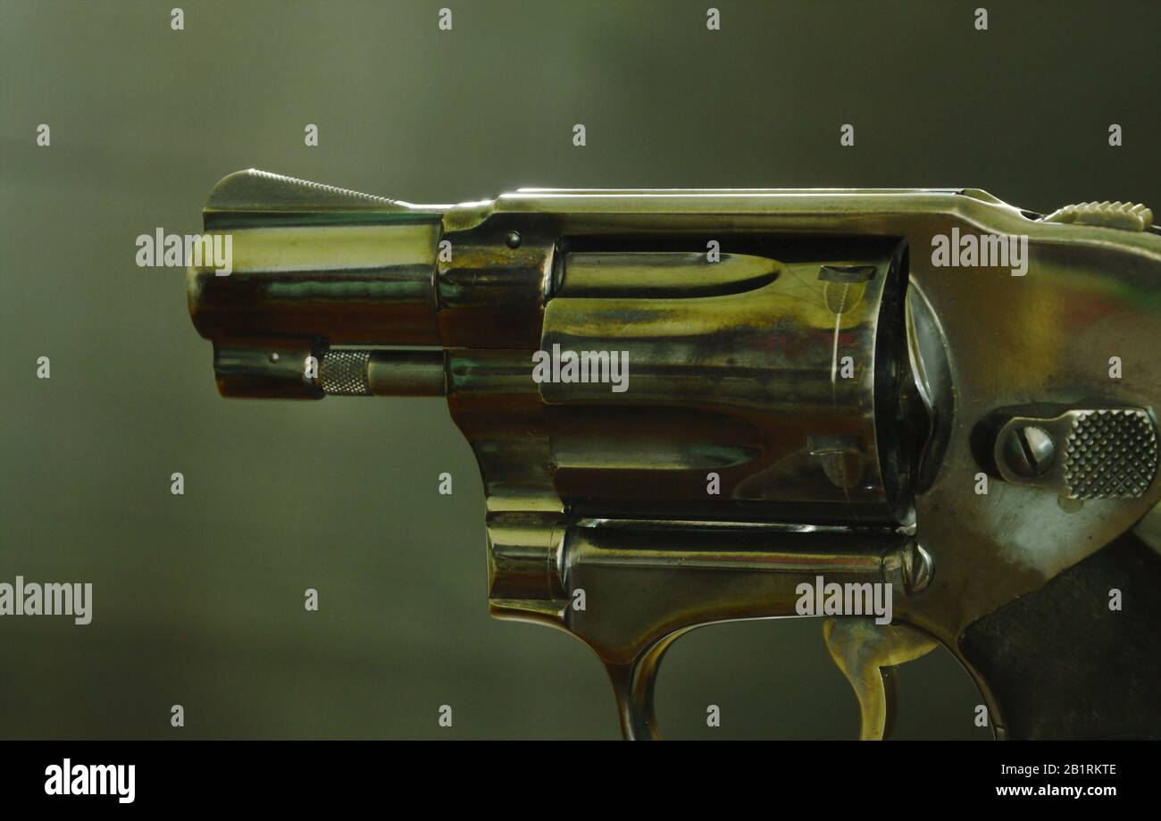 revolver gun ready to shoot on black background Stock Photo - Alamy