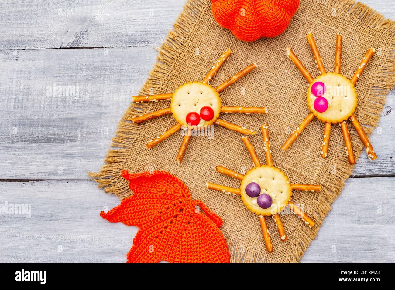 Funny kids food. Edible spiders from cookies, small candies and sweet ...