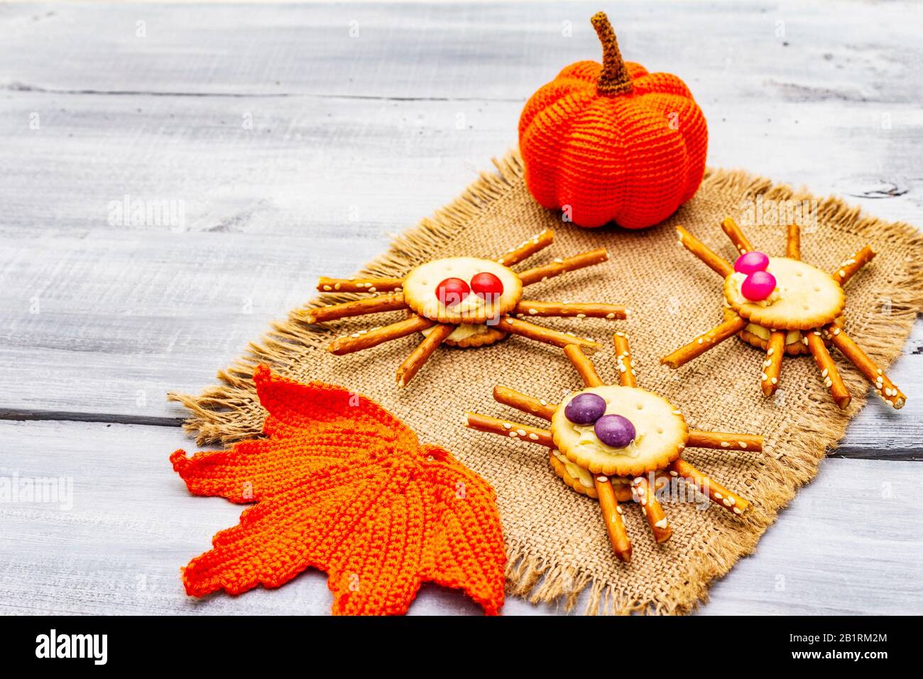Funny kids food. Edible spiders from cookies, small candies and sweet ...