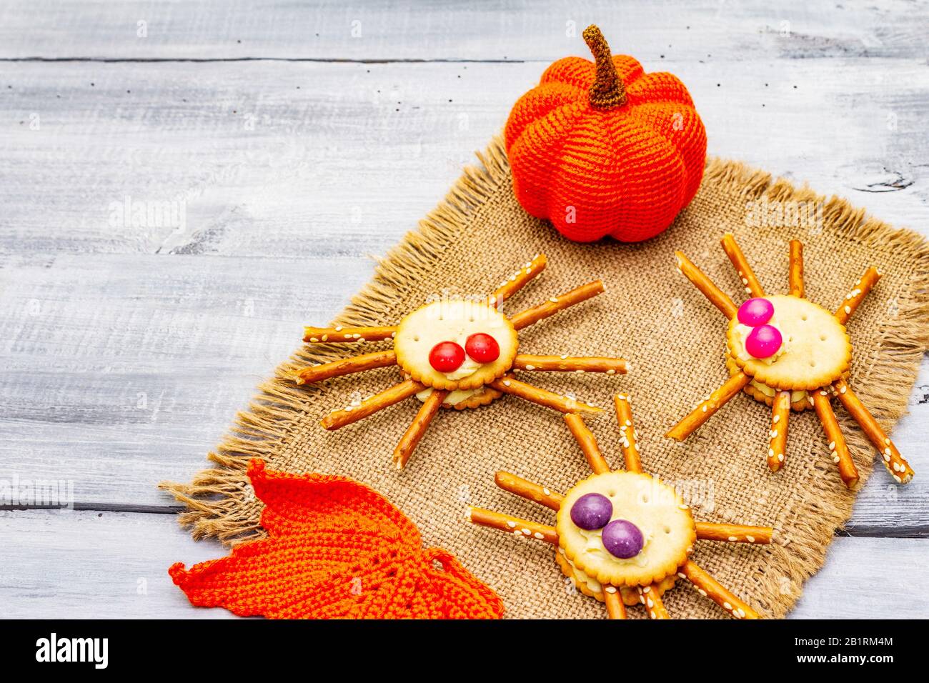 Funny kids food. Edible spiders from cookies, small candies and sweet ...