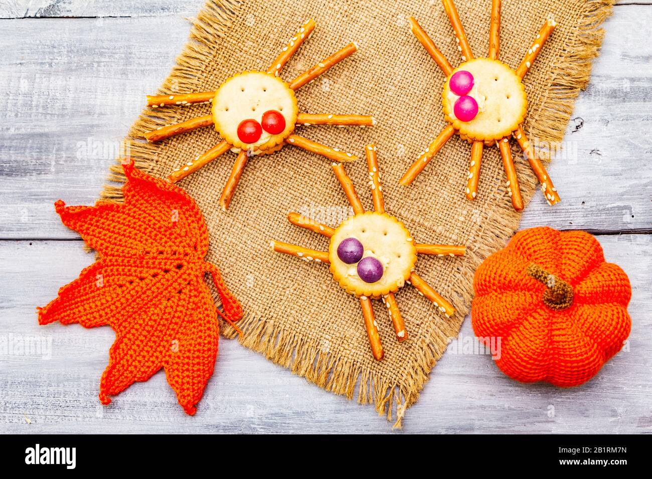 Funny kids food. Edible spiders from cookies, small candies and sweet ...