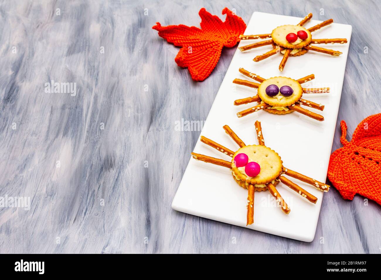 Funny kids food. Edible spiders from cookies, small candies and sweet ...
