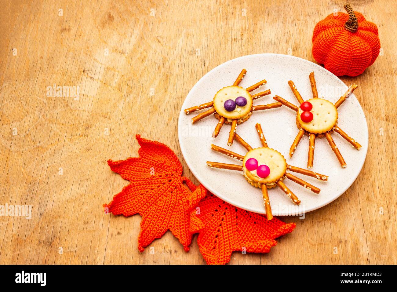 Funny kids food. Edible spiders from cookies, small candies and sweet ...