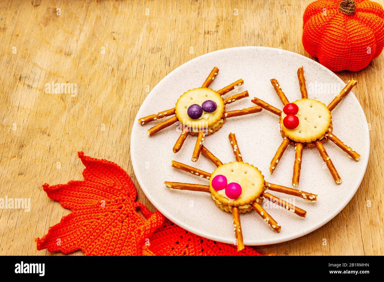 Funny kids food. Edible spiders from cookies, small candies and sweet ...