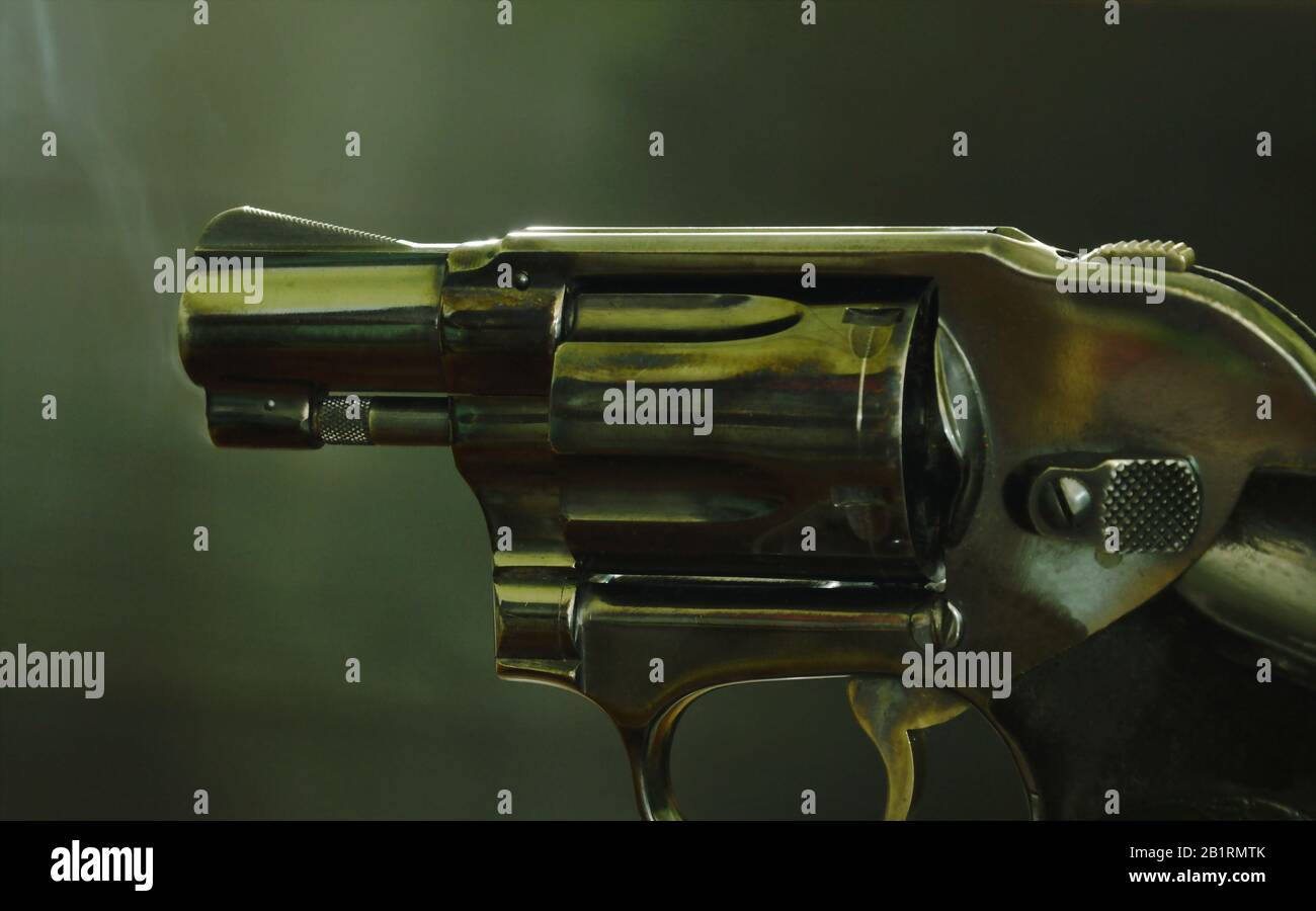 revolver gun ready to shoot on black background Stock Photo - Alamy