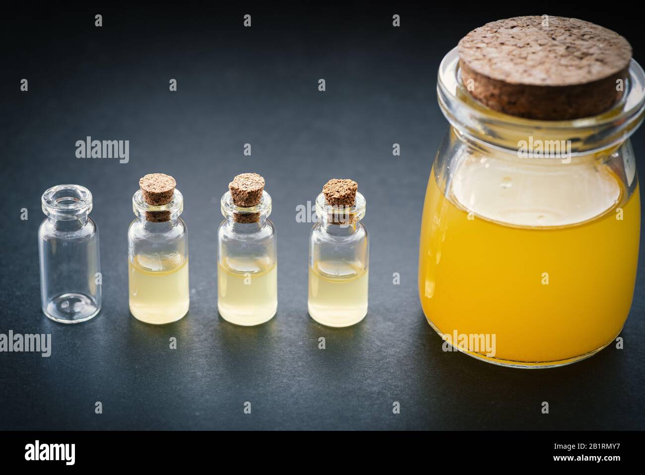 Orange colored liquid in a bottle. Concept Stock Photo - Alamy