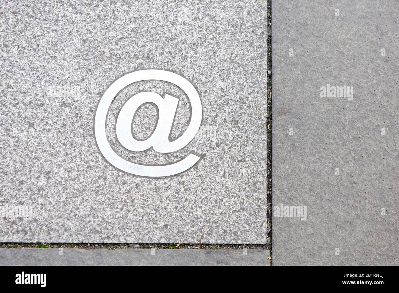 at-sign on granite plate Stock Photo - Alamy