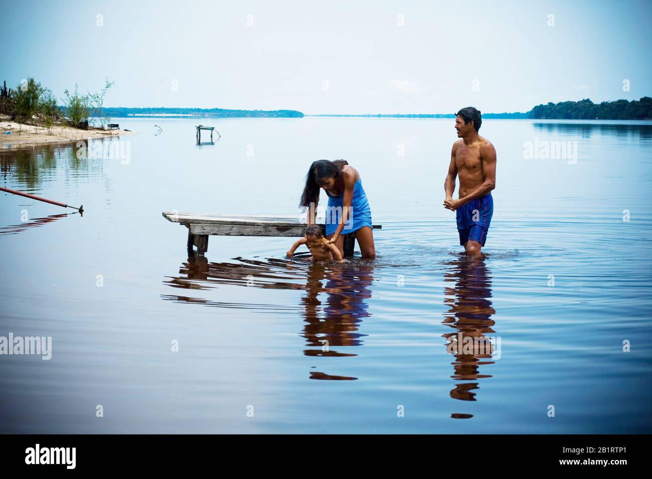 Father and son taking a bath in a river hi-res stock photography and ...