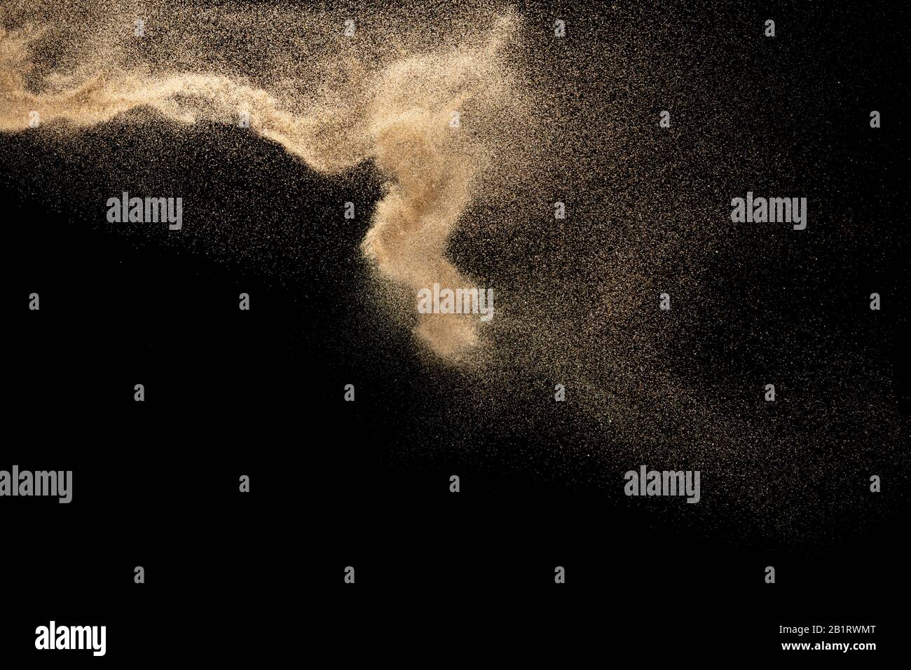 Dry river sand explosion.Brown color sand splash against black ...