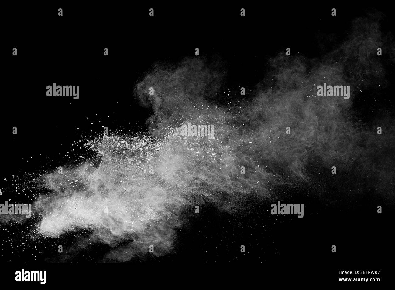 White powder explosion isolated on black background.White dust ...