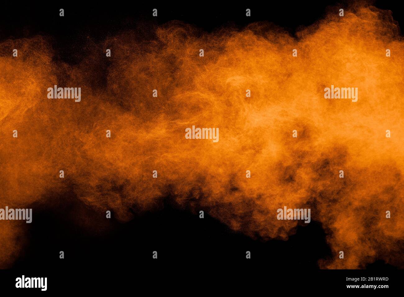 Orange powder explosion on black background. Orange color dust splash ...