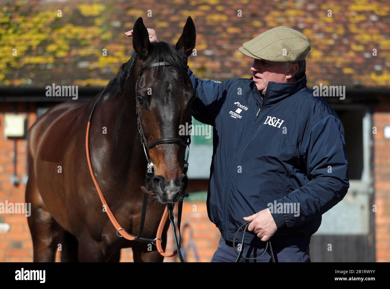 Trainer Paul Nicholls poses for a photograph with Frodon in the yard ...