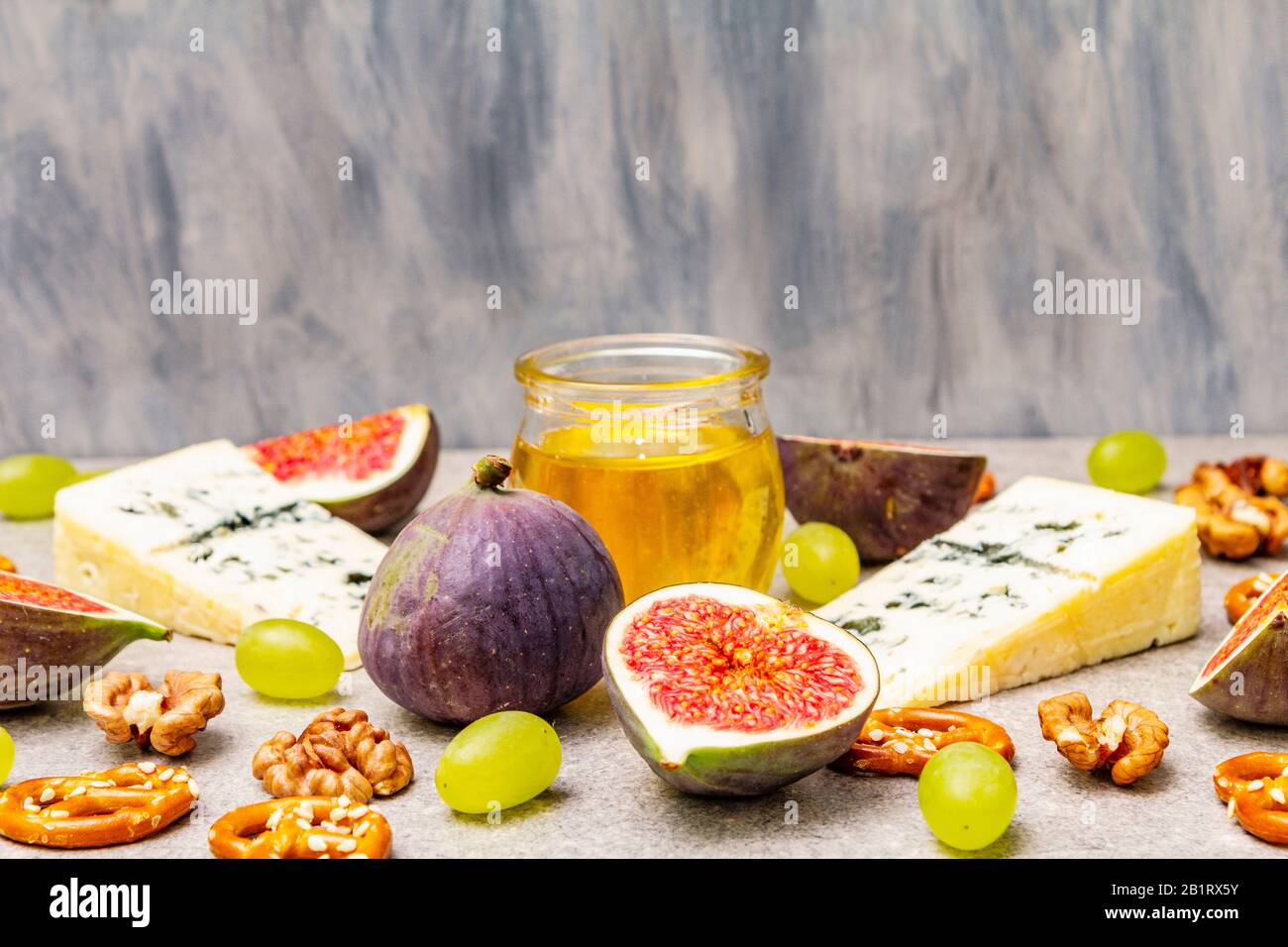 Cheese appetizer selection or wine snack set. Blue cheese, figs, grapes ...