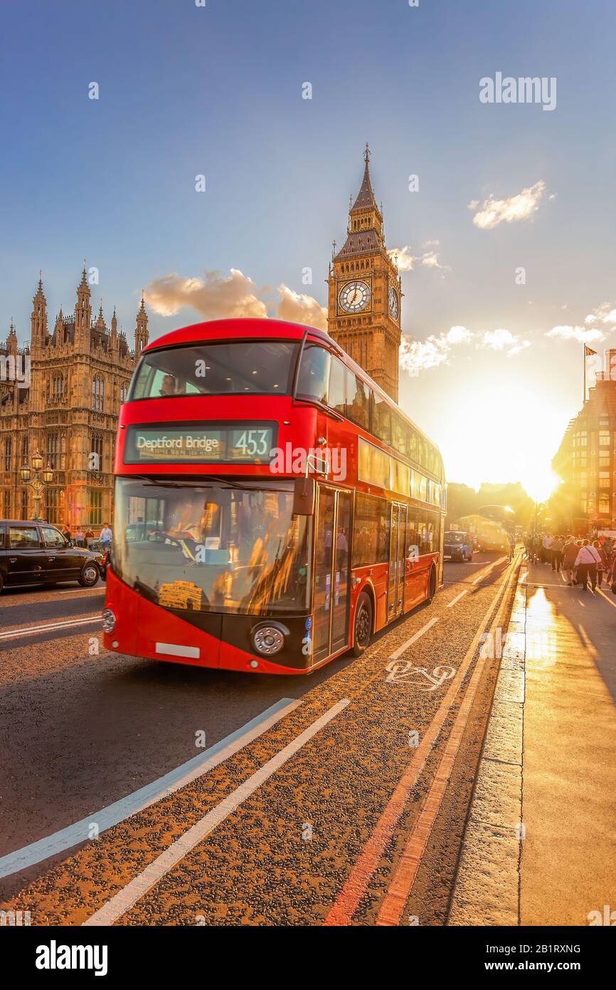 Big Ben with red bus against colorful sunset in London, England, UK ...