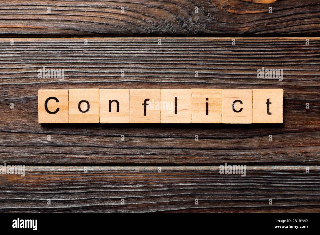 CONFLICT word written on wood block. CONFLICT text on wooden table for ...