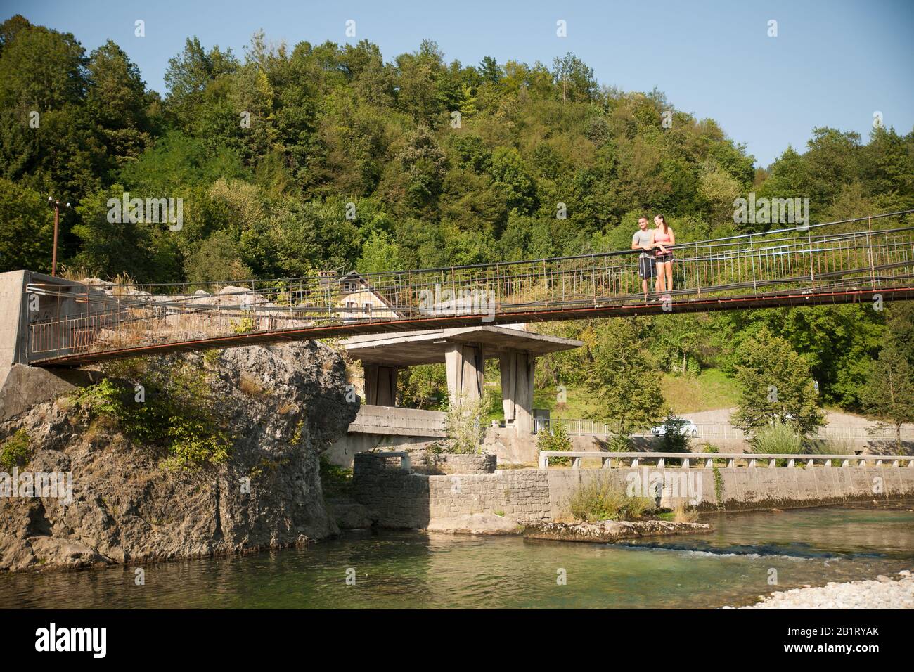 Couple looking over a bridge hi-res stock photography and images - Alamy