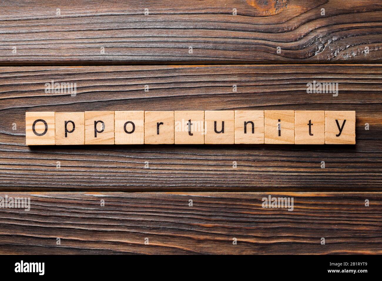 Opportunity word written on wood block. Opportunity text on table ...