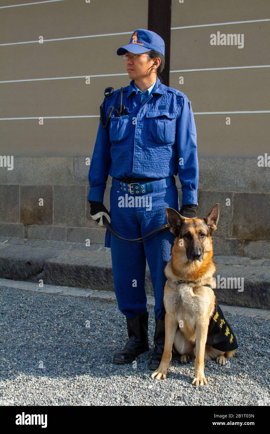 Japanese Guard with a watchdog at the Imperial Palace, Kyoto, Japan ...
