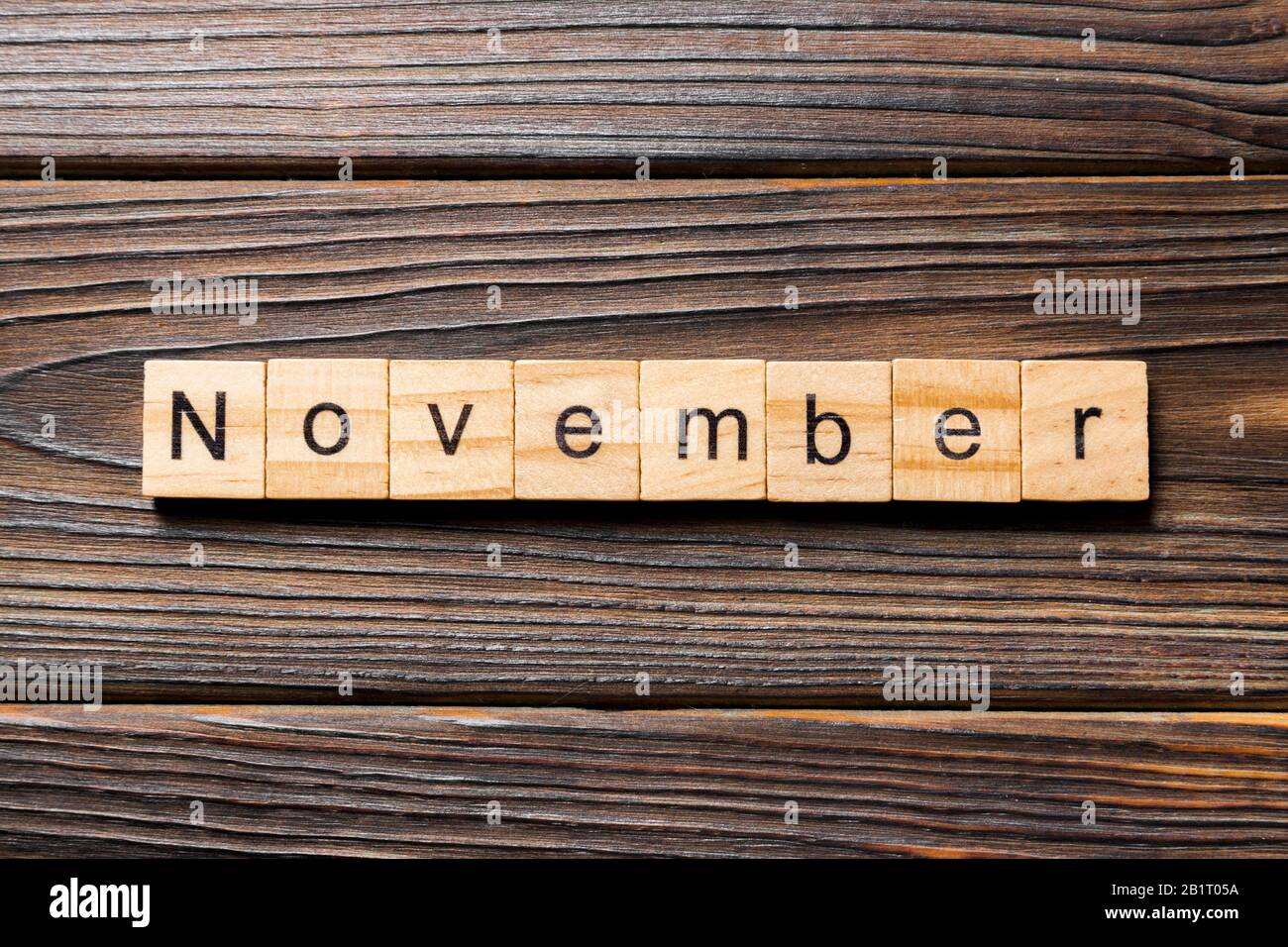 November word written on wood block. November text on wooden table for ...