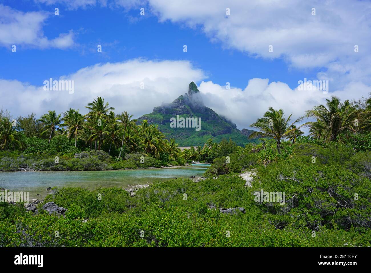 View of the Mont Otemanu mountain reflecting in water in Bora Bora ...
