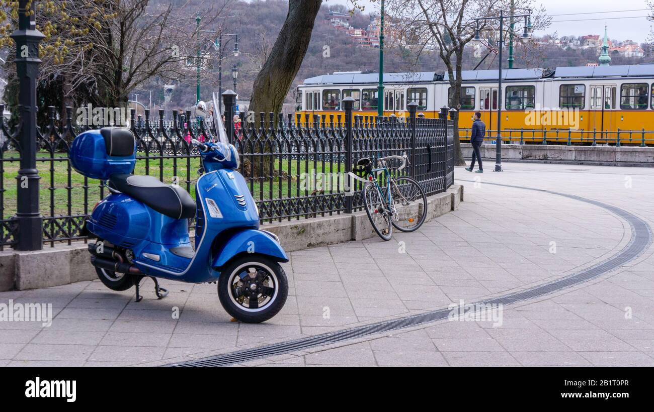 Budapest, Hungary 03 16 2019: Old Blue Vespa scooter parked in a street ... Budapest, Hungary 03 16 2019: Old Blue Vespa scooter parked in a street ...