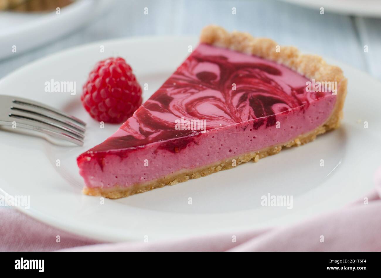 Raspberry Swirl Cheesecake Tart on White Background Stock Photo - Alamy