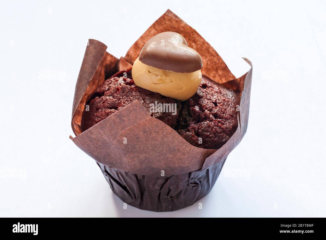 chocolate heart muffin fresh from M&S in-store bakery isolated on white ...