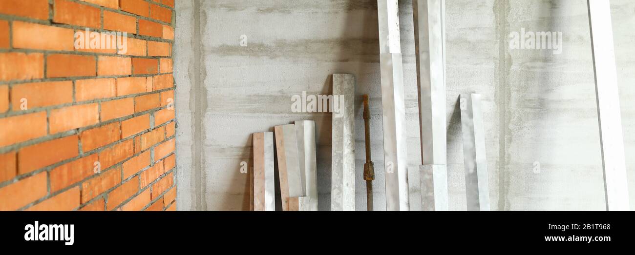 Set of finishing building tools standing at wall Stock Photo - Alamy