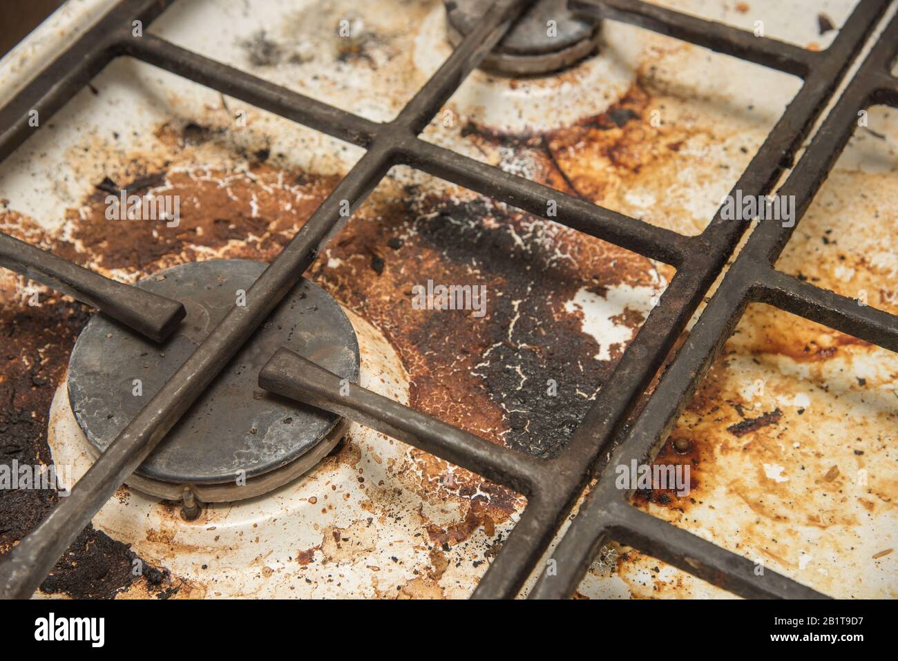 Dirty gas stove stained while cooking Stock Photo - Alamy