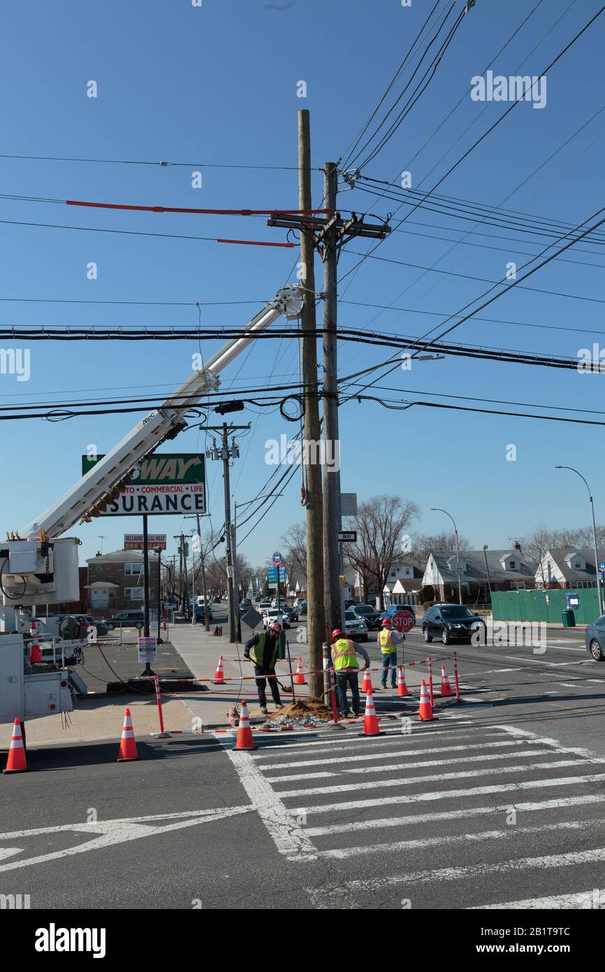 A sequence of images of a wooden electrical utility pole being replaced ...