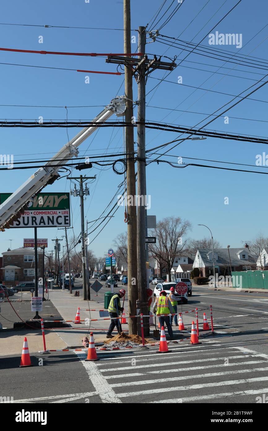 A sequence of images of a wooden electrical utility pole being replaced ...