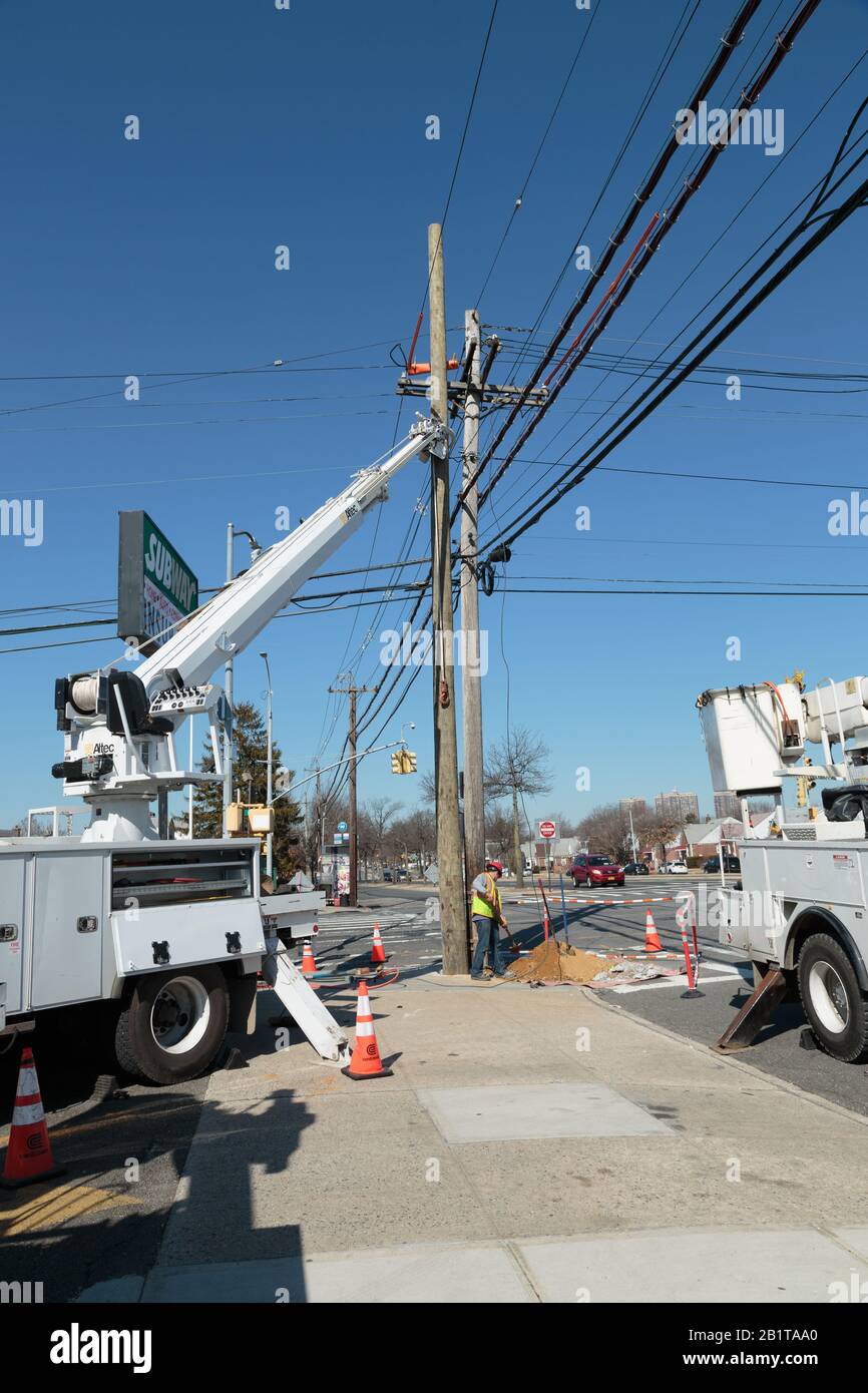 A sequence of images of a wooden electrical utility pole being replaced ...