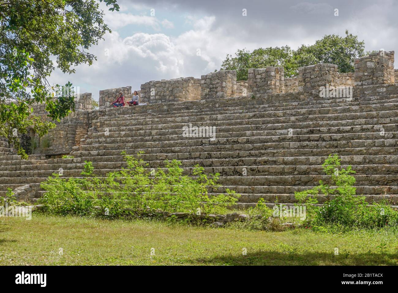 Dzibilchaltun, Yucatan, Mexico: Two women meditating on Structure 44, a ...