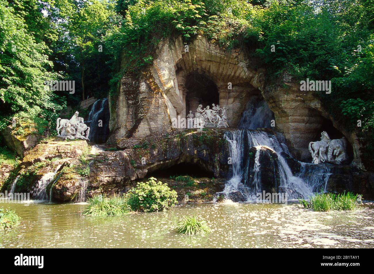 Statues and caves in the garden at the palace of Versailles near Paris ...