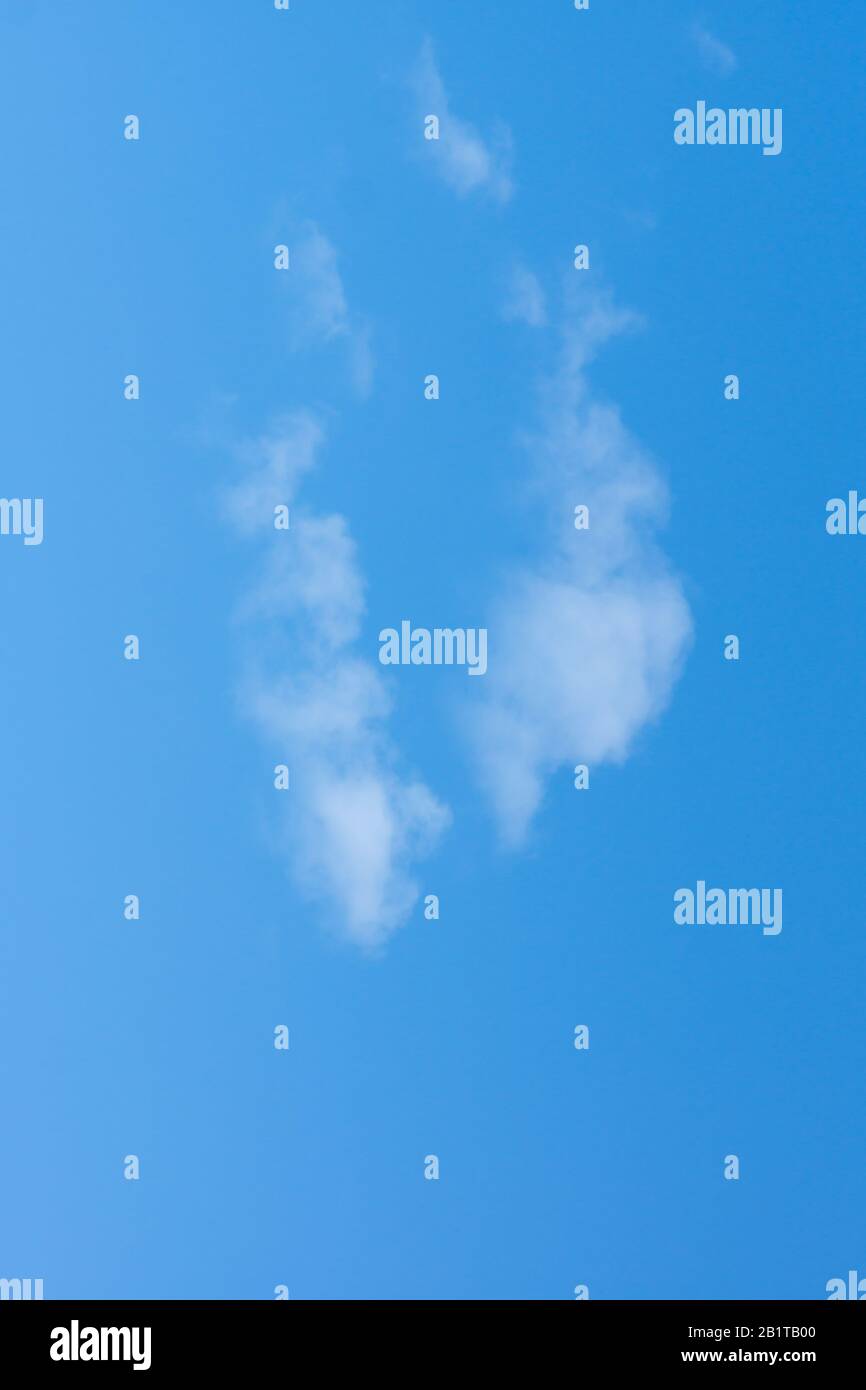 blue sky with flying white light clouds Stock Photo - Alamy