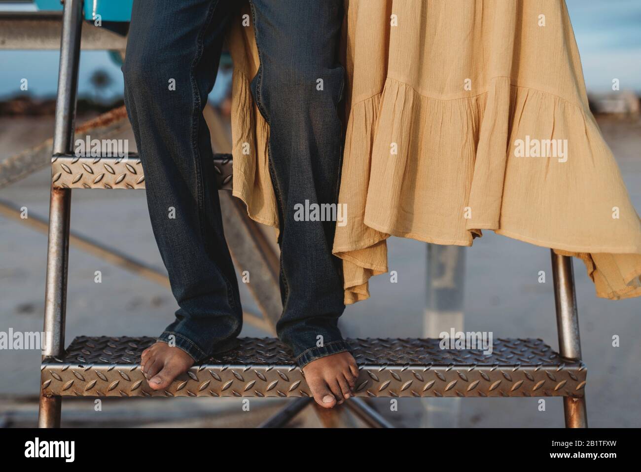 Detail image of mother and son sandy feet on lifeguard tower Stock ...