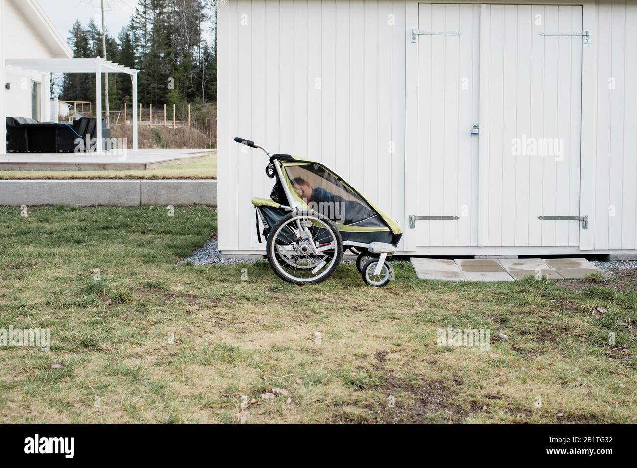 kid sleeping in a stroller outside in Sweden Stock Photo - Alamy