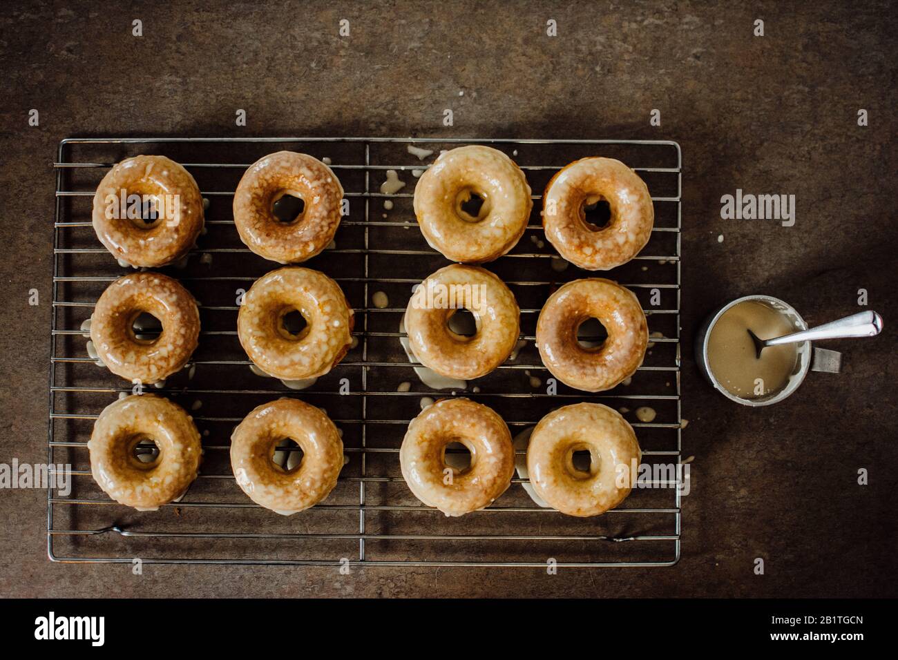 Hot Frosted Doughnuts on a Cooling Rack with a Perspective from Above ...