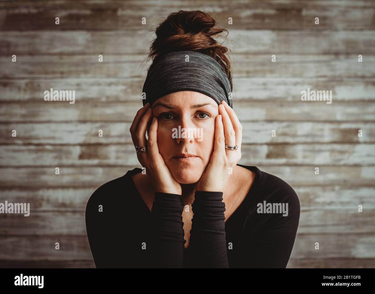 Face resting in here hands hi-res stock photography and images - Alamy
