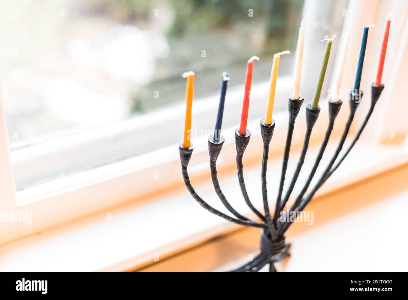 Menorah with unlit candles for Hanukkah celebrations in a window Stock ...
